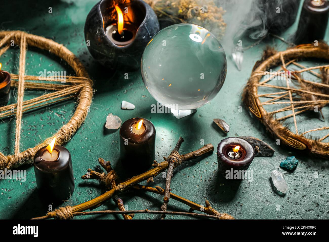 Magic attributes of fortune teller on green table Stock Photo - Alamy