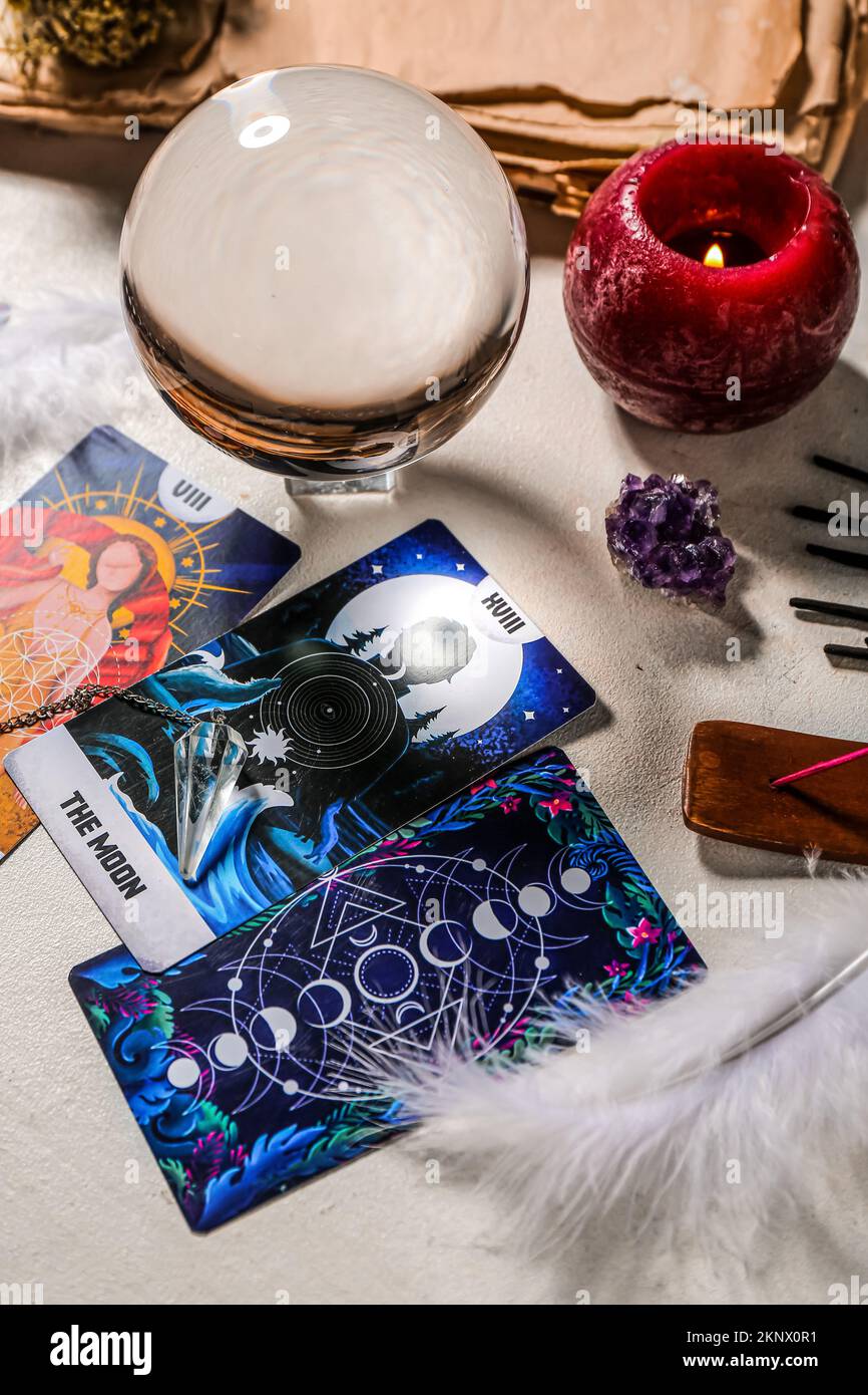 Magic attributes of fortune teller on table Stock Photo - Alamy