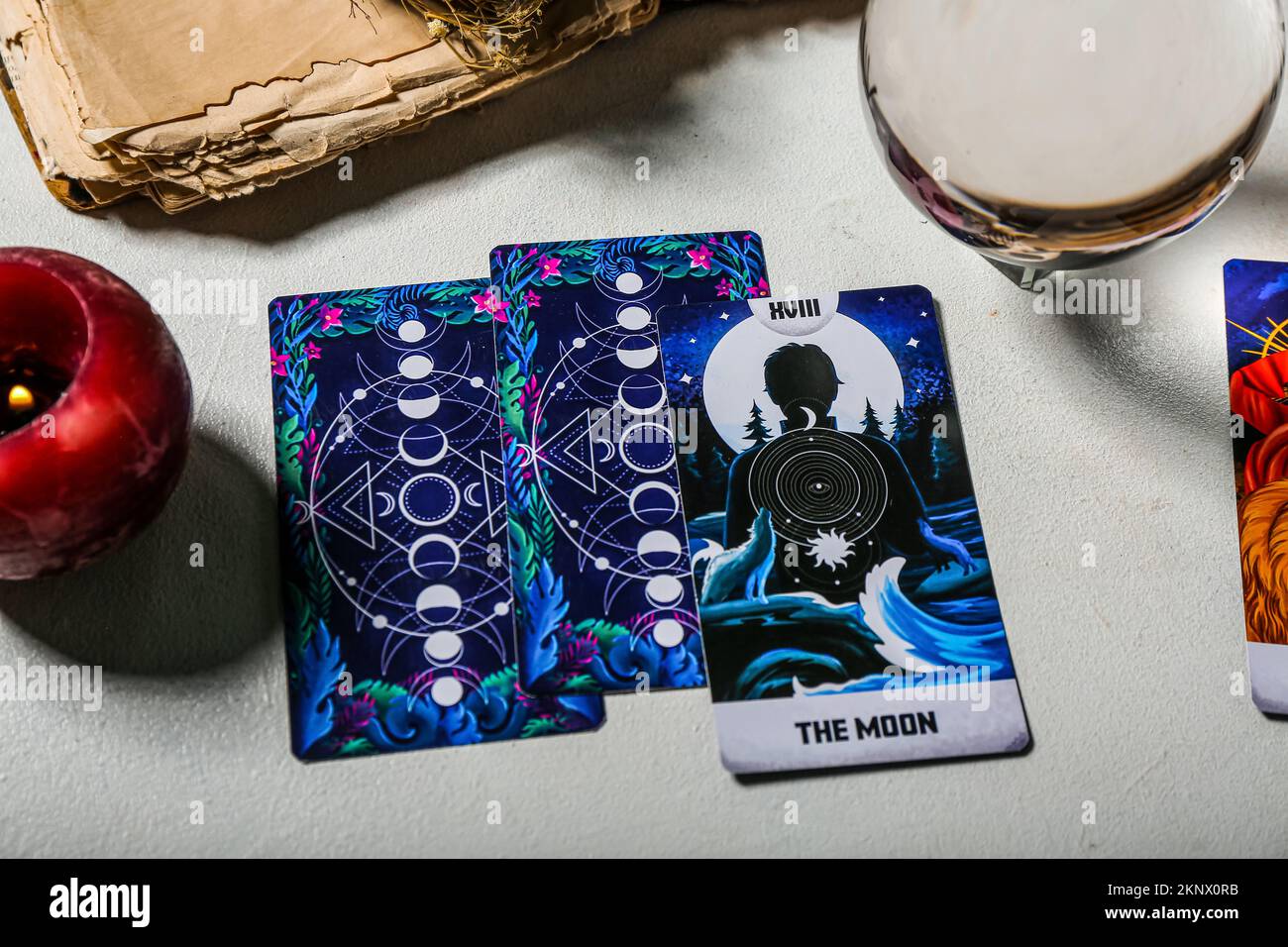 Tarot cards and magic attributes on table Stock Photo - Alamy