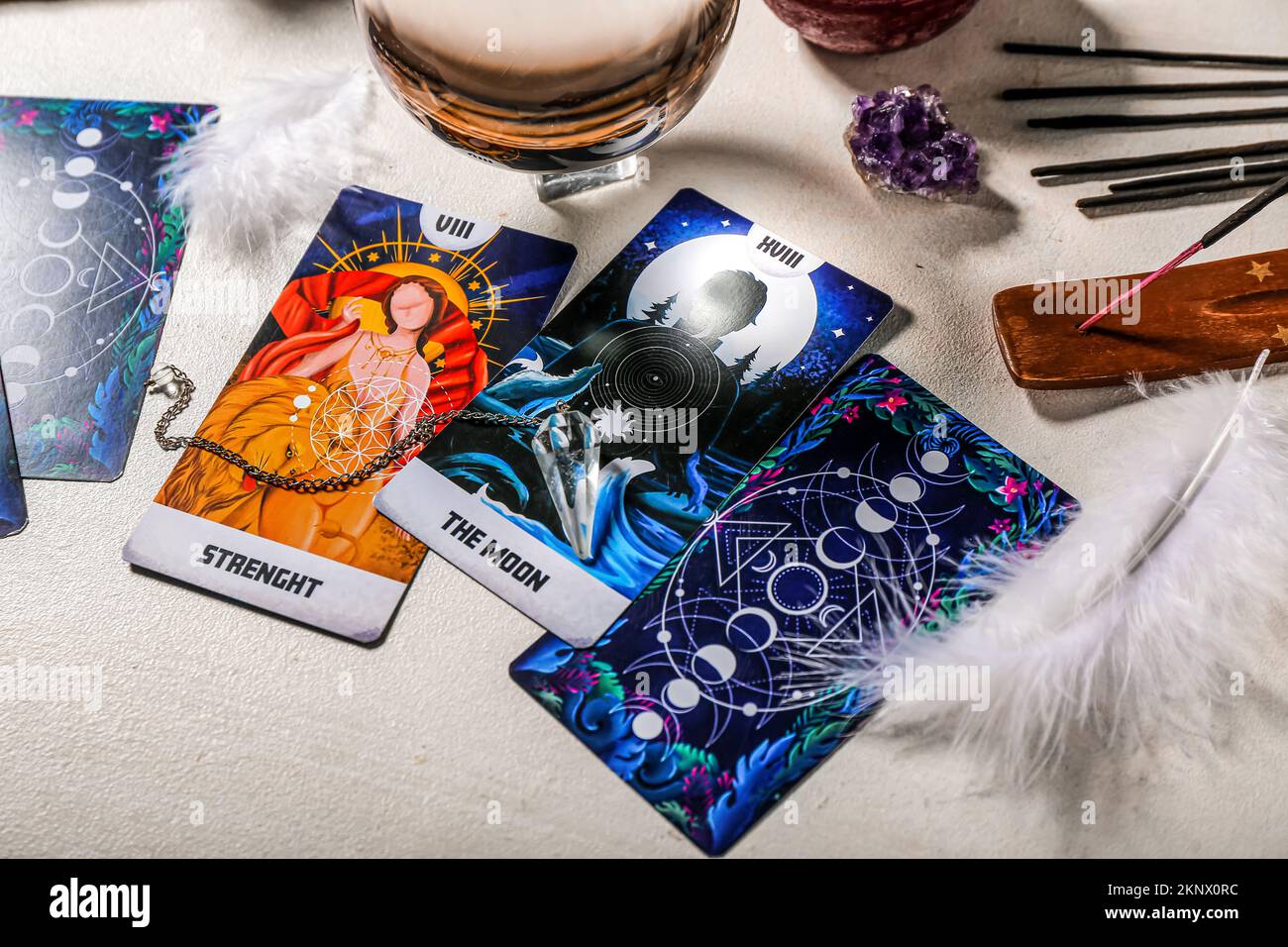Tarot cards and magic attributes on table Stock Photo - Alamy