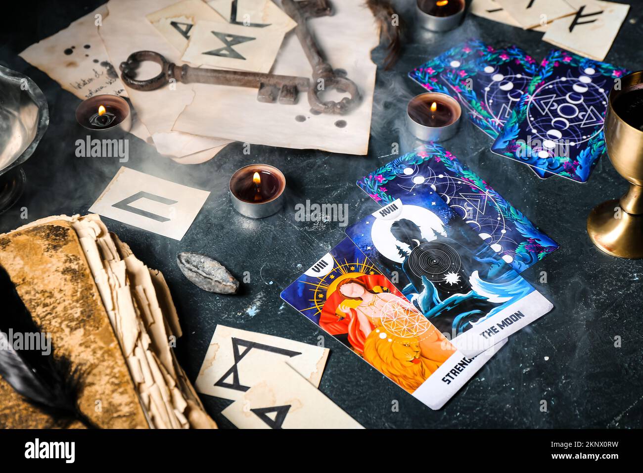 Magic attributes of fortune teller on dark table Stock Photo - Alamy