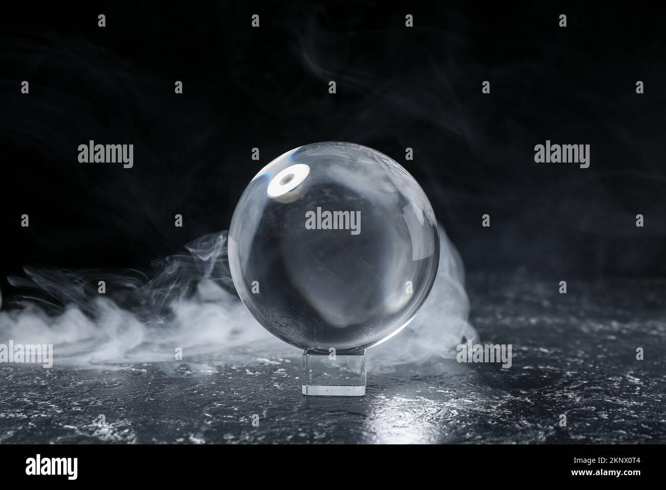 Crystal ball of fortune teller and smoke on dark background Stock Photo ...