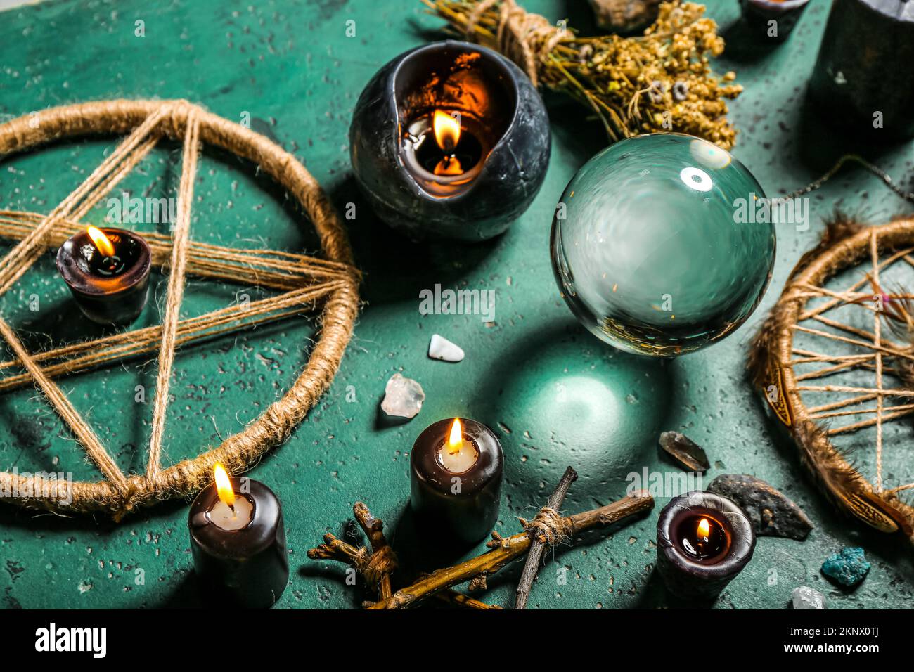 Magic attributes of fortune teller on green table Stock Photo - Alamy