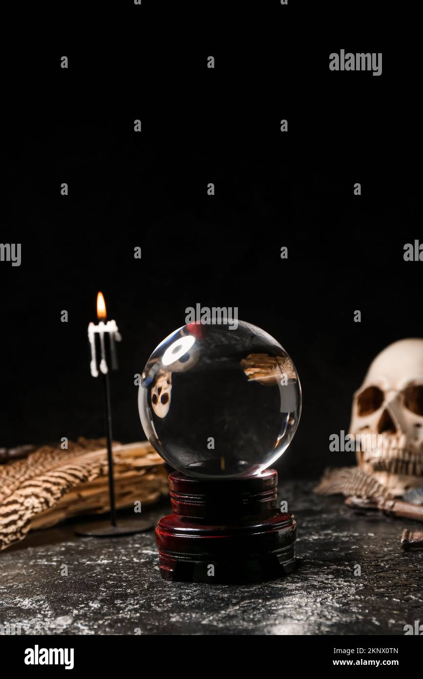 Crystal ball and magic attributes of fortune teller on table Stock ...