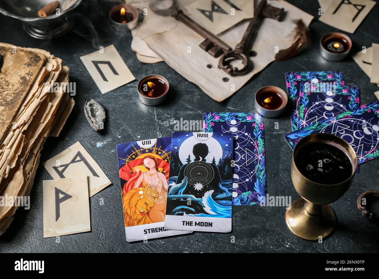 Magic attributes of fortune teller on dark table Stock Photo - Alamy
