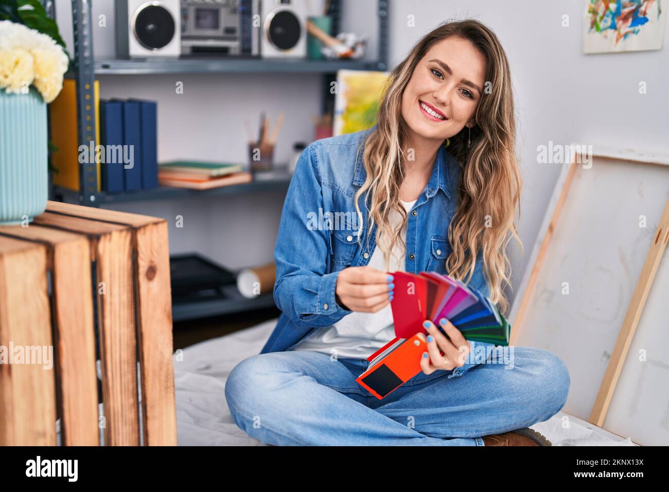 Young woman artist smiling confident choosing color at art studio Stock ...