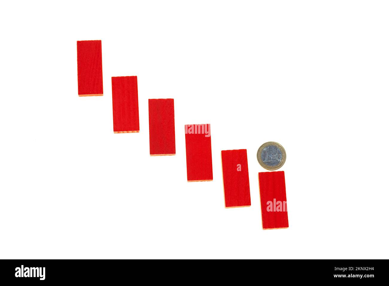 Falling euro currency.One euro coin on a red step ladder isolated on a ...