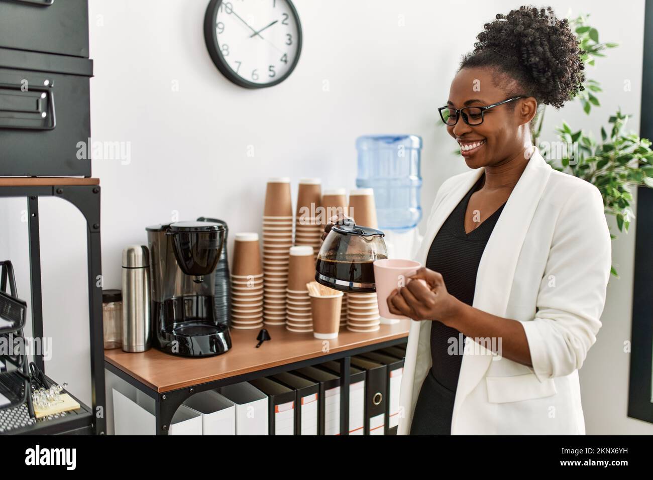 Pouring coffee at work for the boss hi-res stock photography and images ...