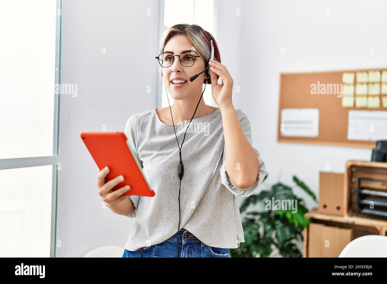 Young caucasian call center agent working at the office Stock Photo - Alamy
