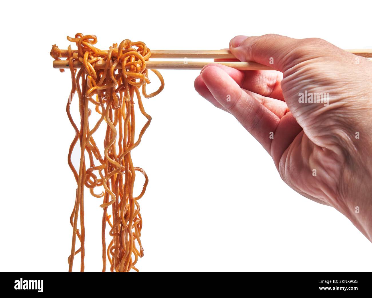 Hand of man holding thai noodles over isolated white background Stock ...