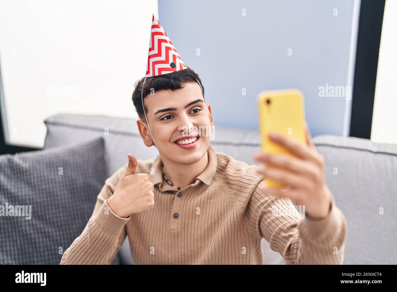 Non binary person celebrating birthday doing video call smiling happy ...