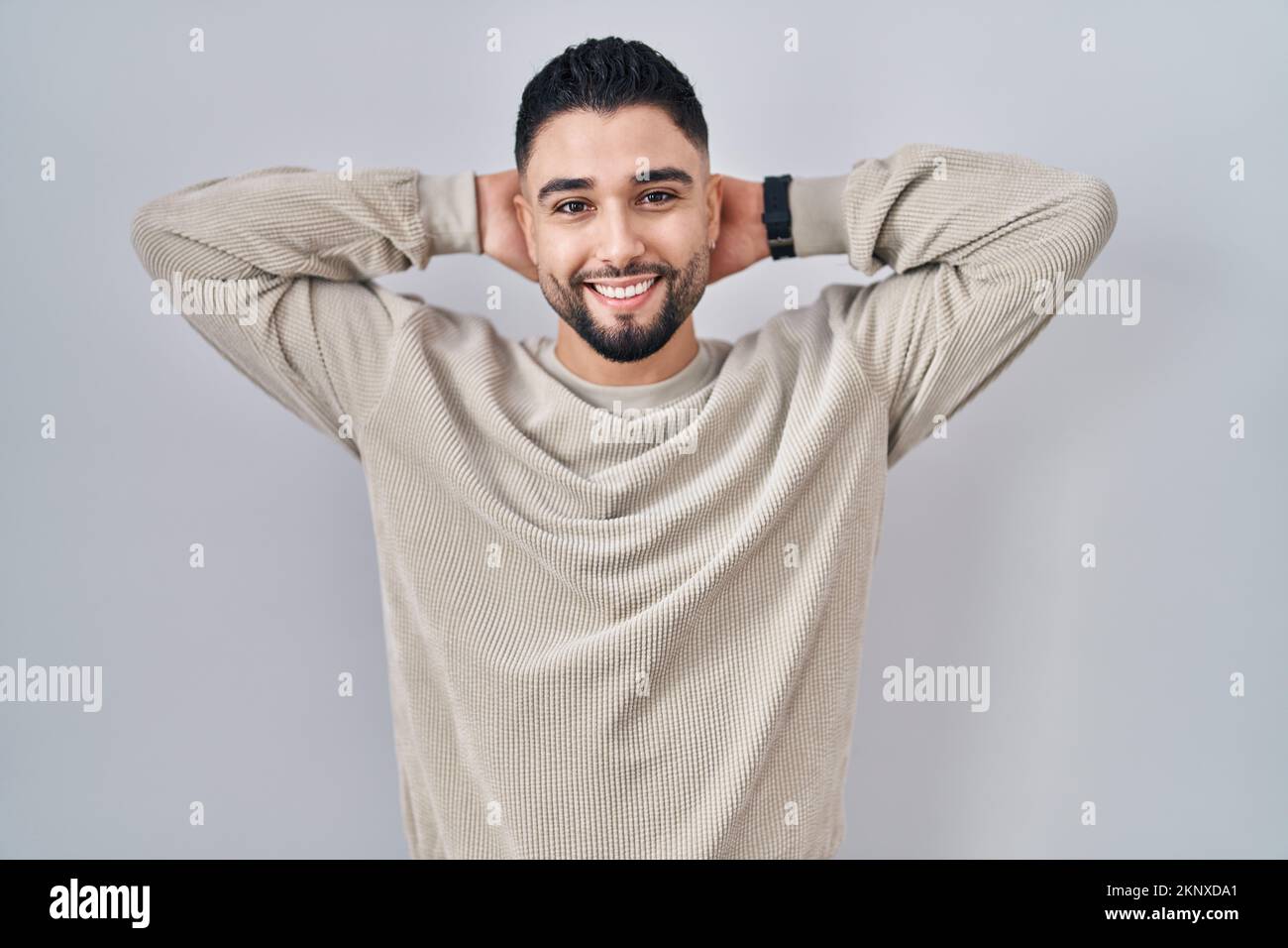Young handsome man standing over isolated background relaxing and ...