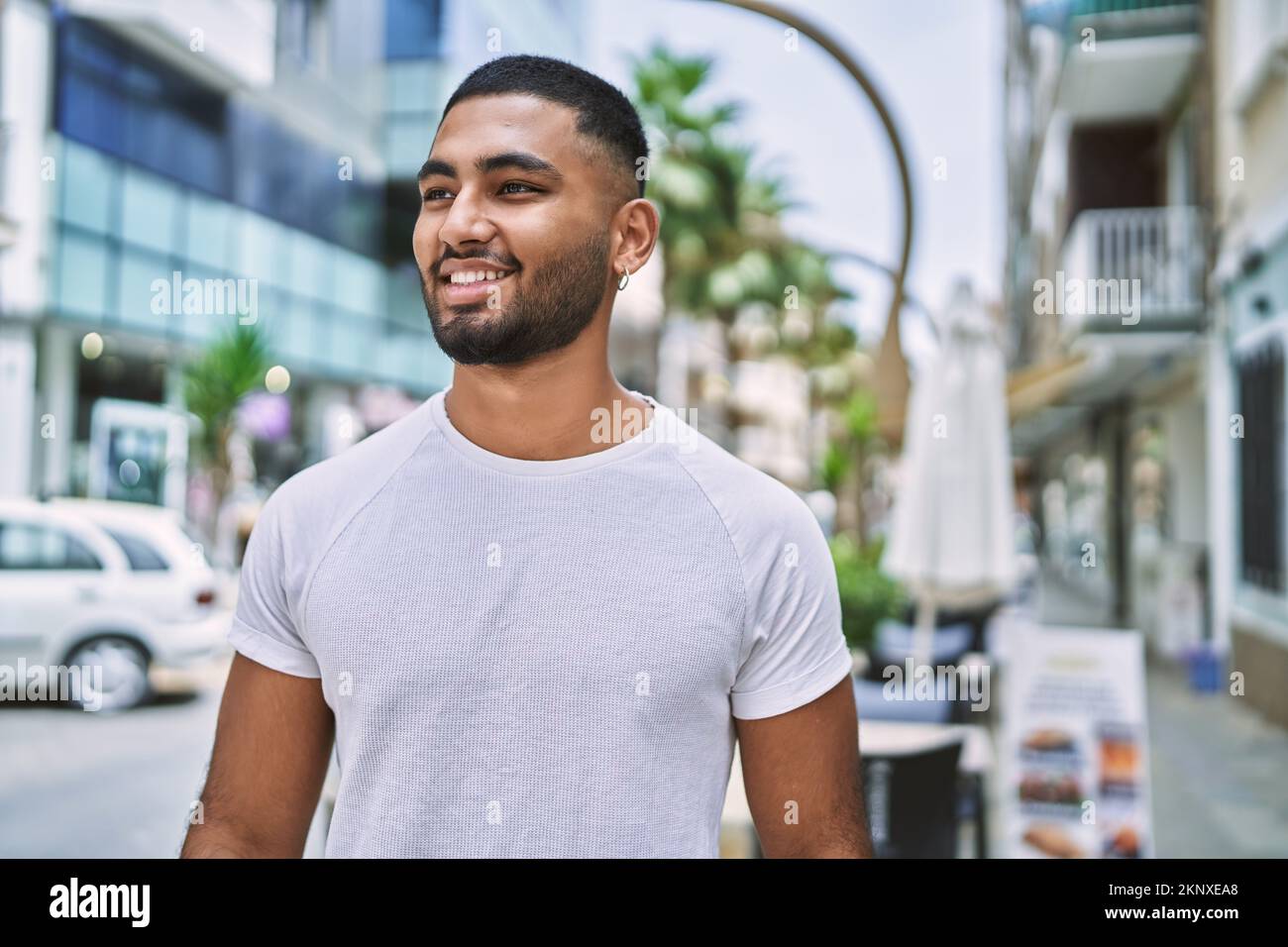 Young middle east man smiling happy standing at the city Stock Photo ...