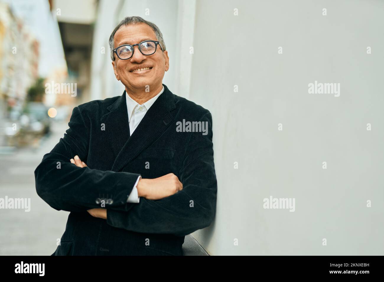 Middle age southeast asian man smiling confident with crossed arms ...