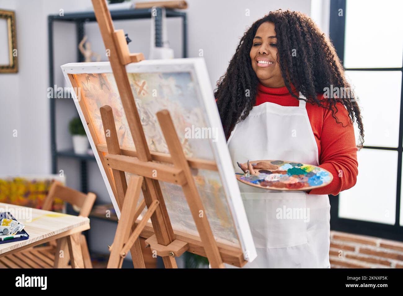 African american woman artist smiling confident drawing at art studio ...