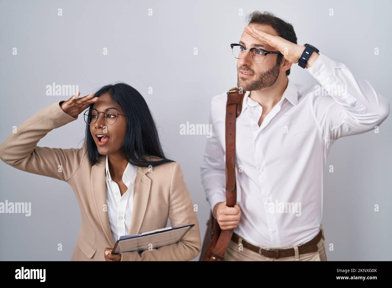 Interracial business couple wearing glasses very happy and smiling ...
