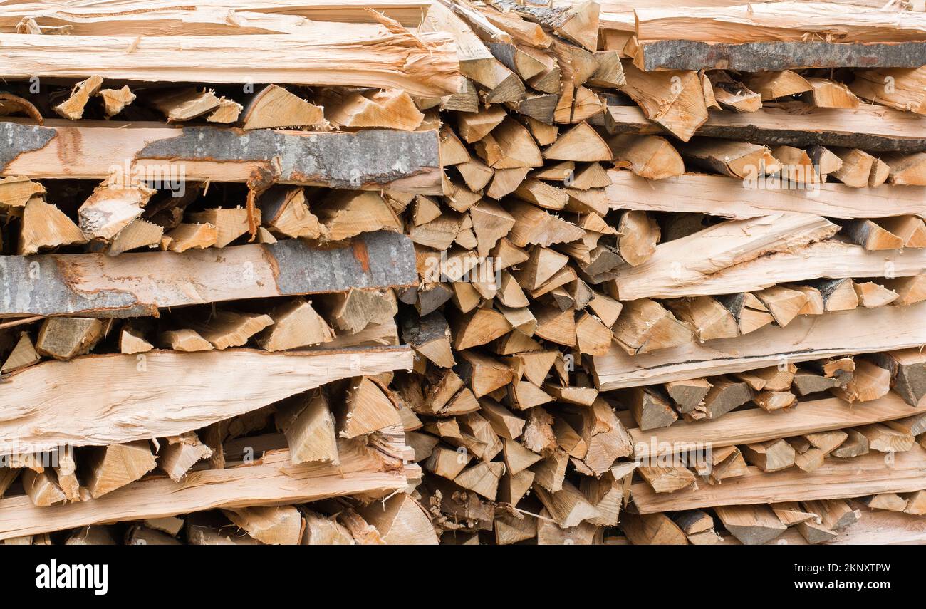 Stacked firewood in several rows in a horizontal format Stock Photo - Alamy