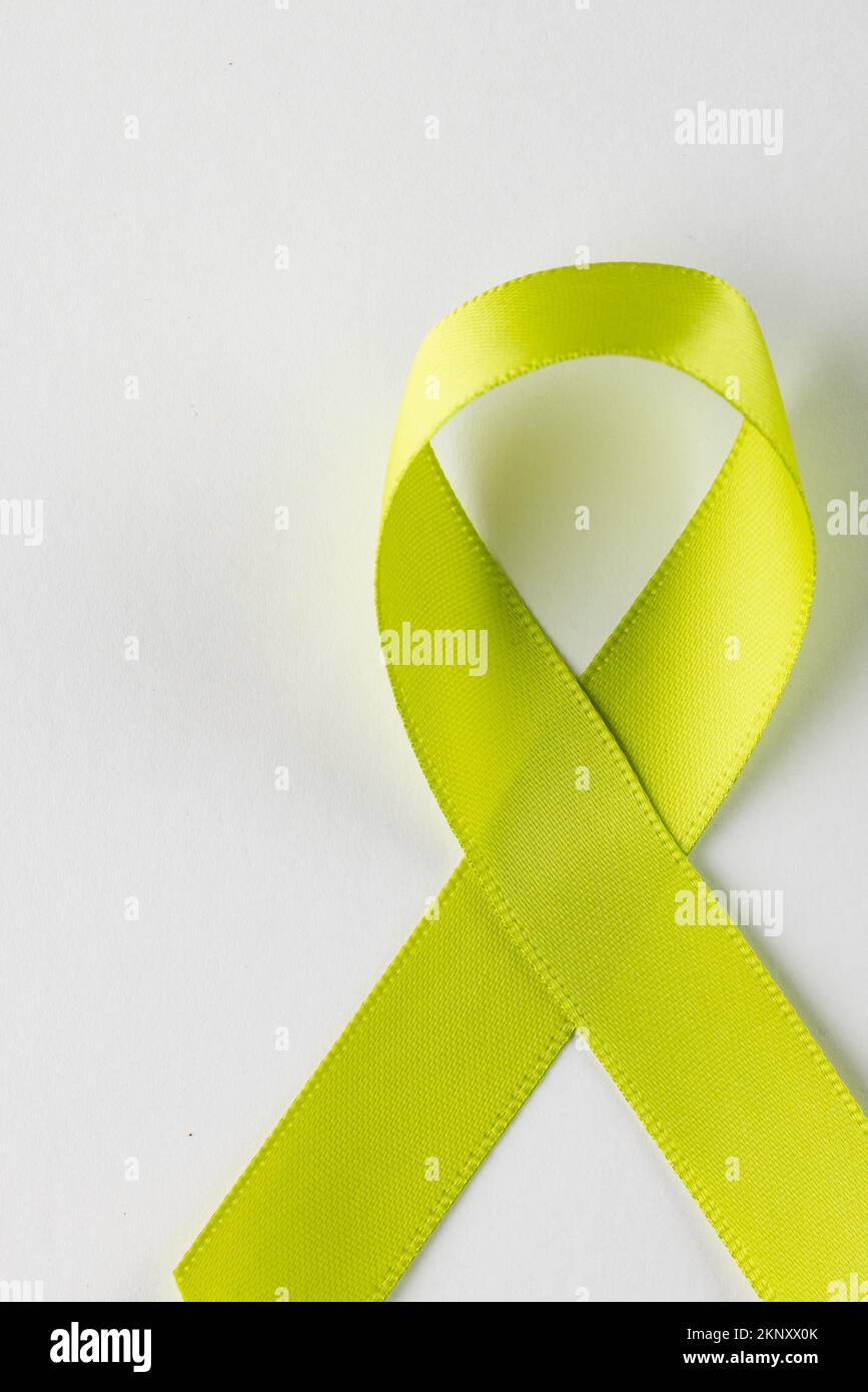 Vertical composition of light green std health awareness ribbon, on ...