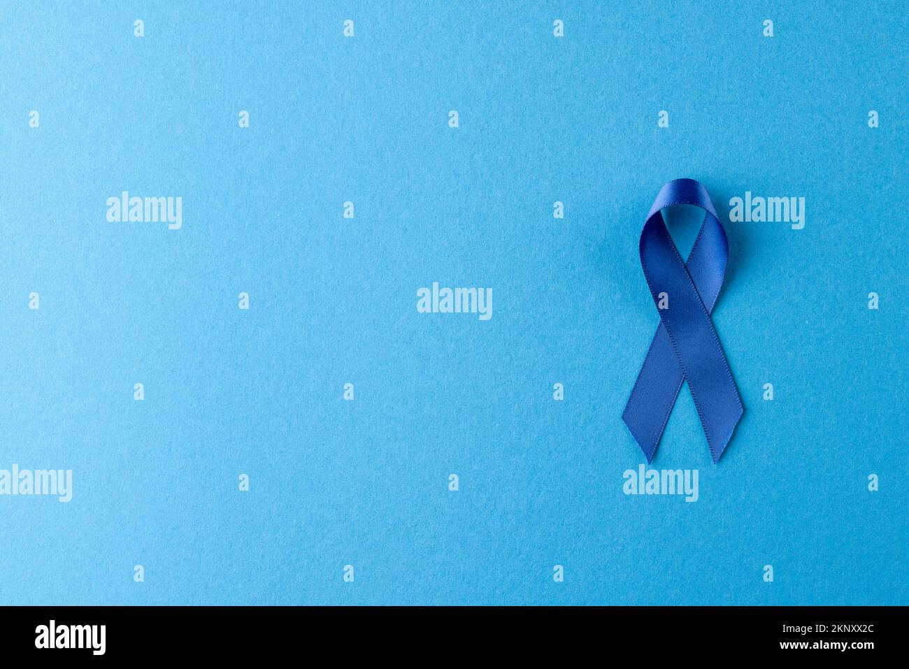 Composition of blue ribbon for prostate cancer awareness, on blue ...
