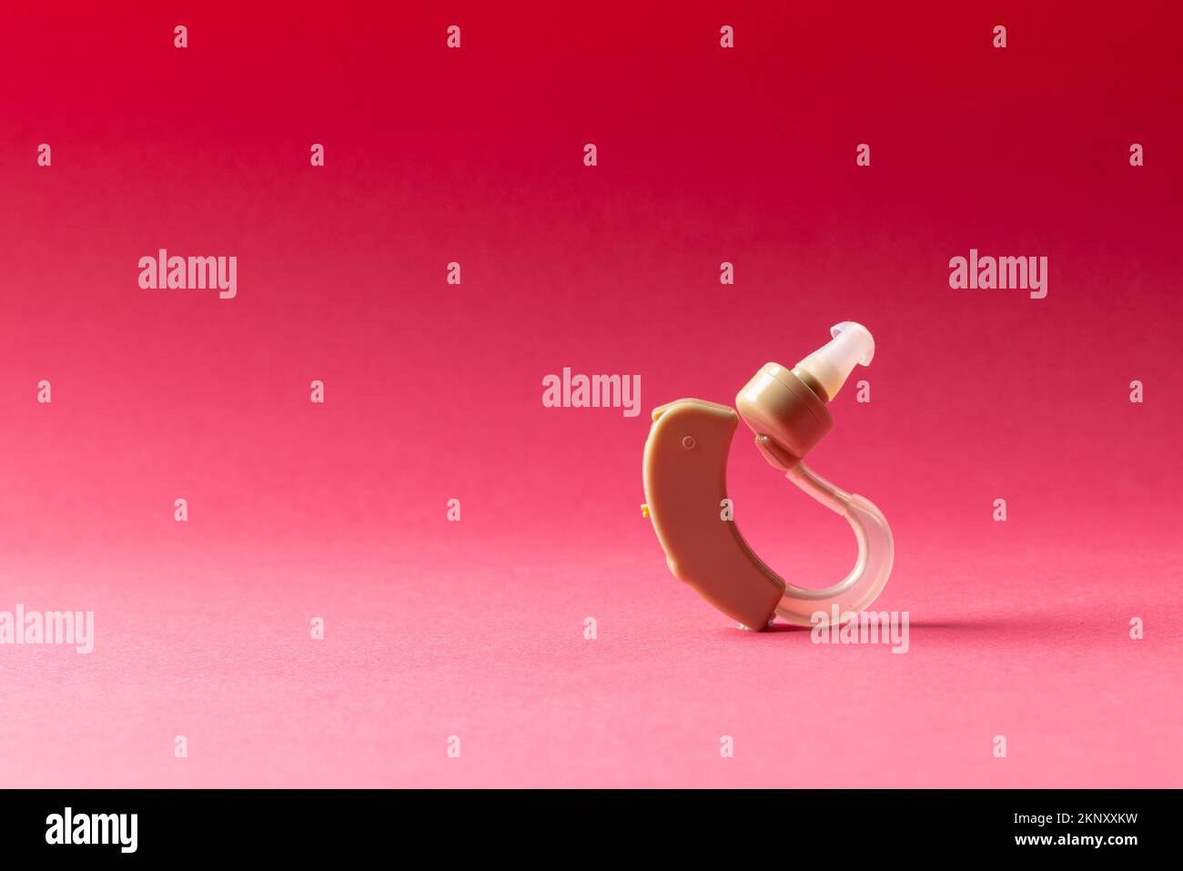 Composition of hearing aid on red background with copy space Stock ...