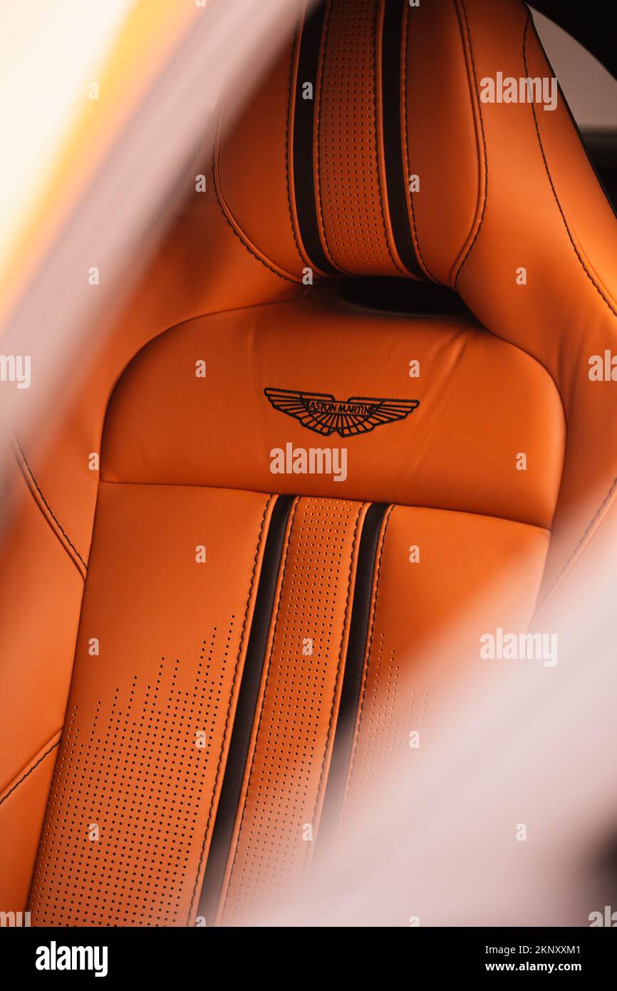 A vertical shot of an Aston Martin Vantage Golden Saffron seat in brown ...