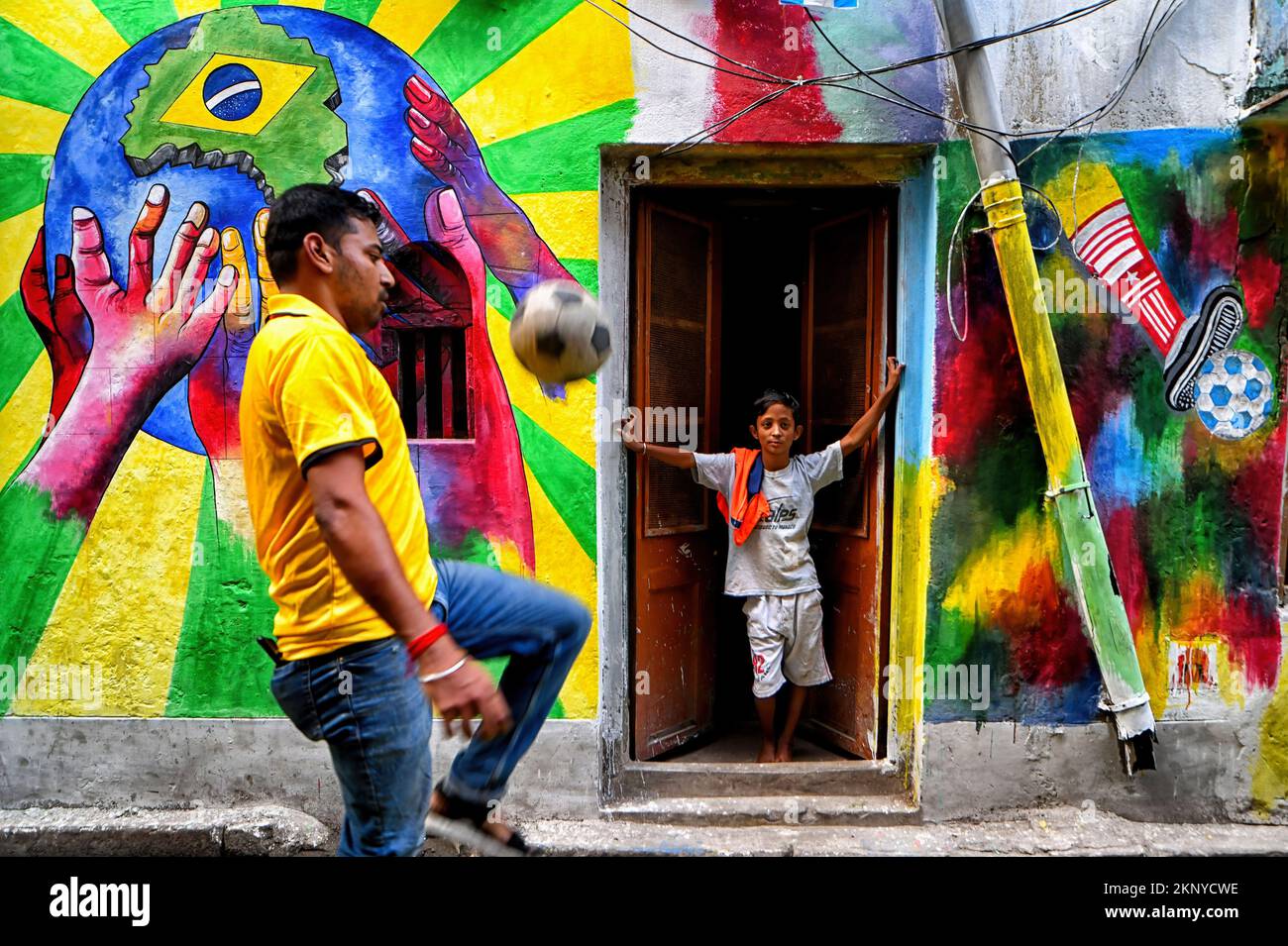 A member of the Dishari club seen playing football in front of street ...