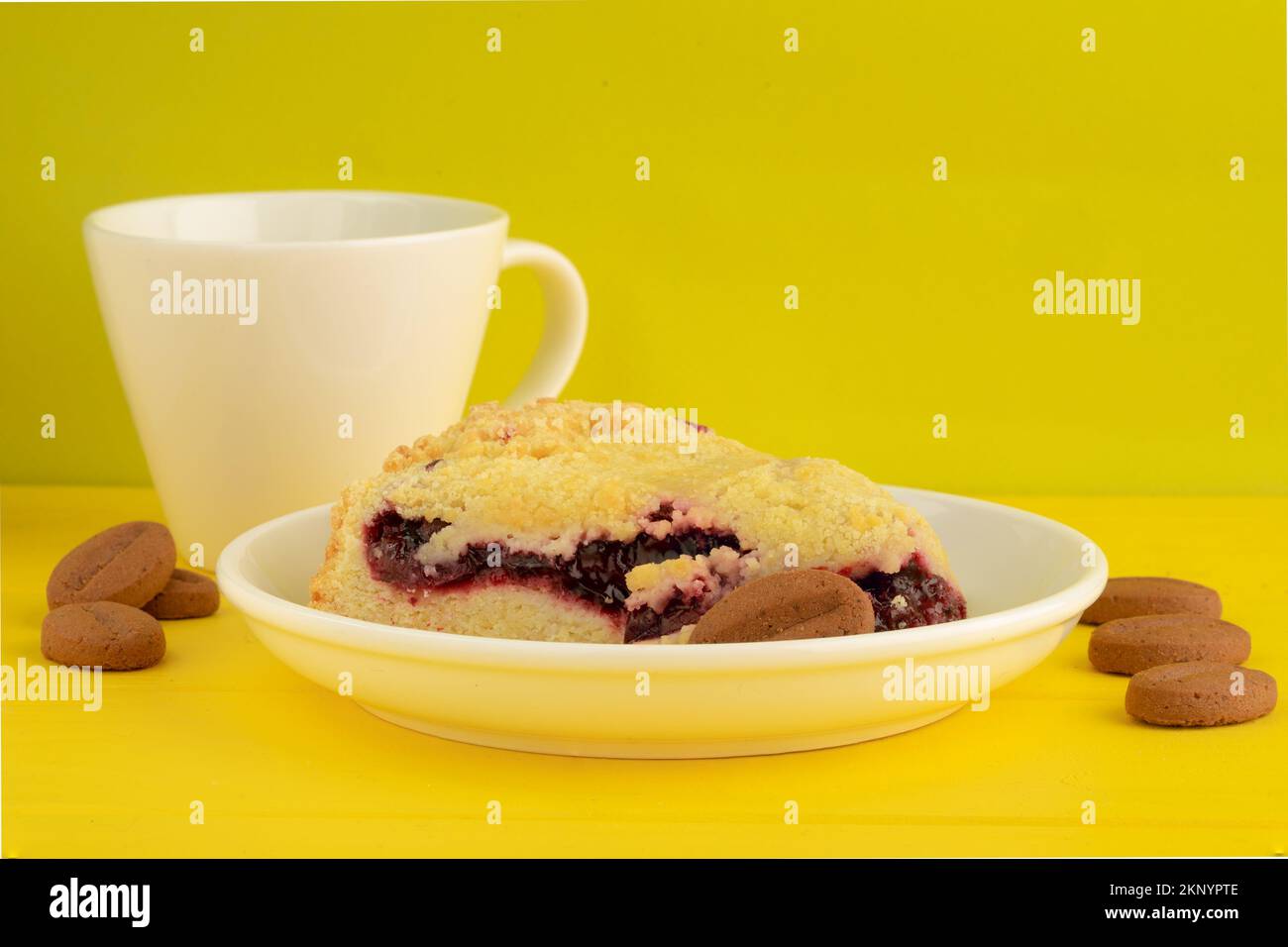 yellow cake with coffee beans and white mug Stock Photo - Alamy