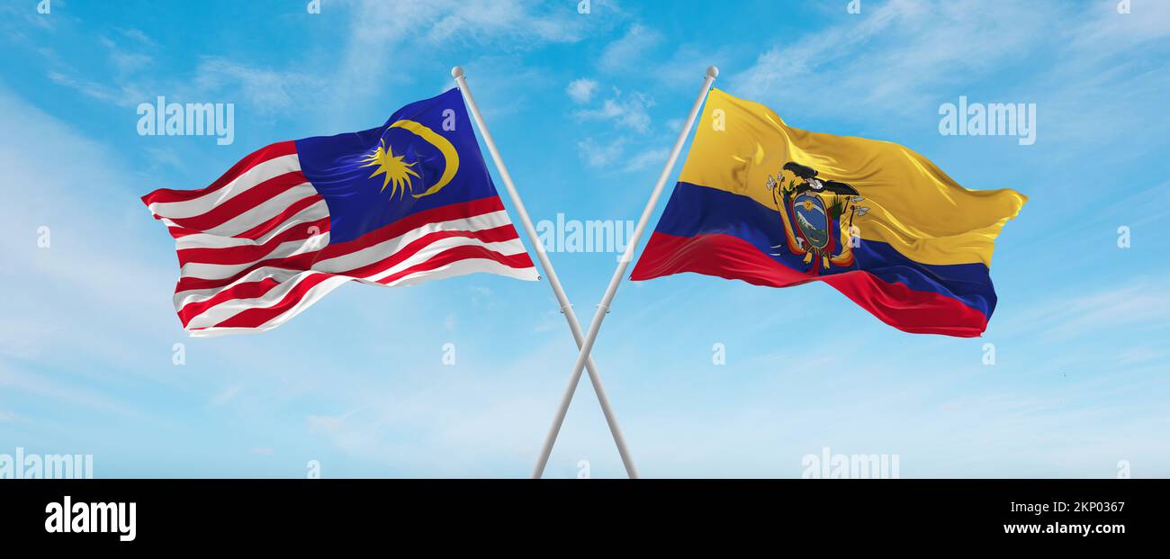 two crossed flags Ecuador and Malaysia waving in wind at cloudy sky ...