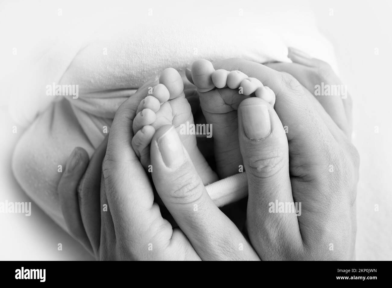 Legs, toes, feet and heels of a newborn. Macro photography, close-up ...