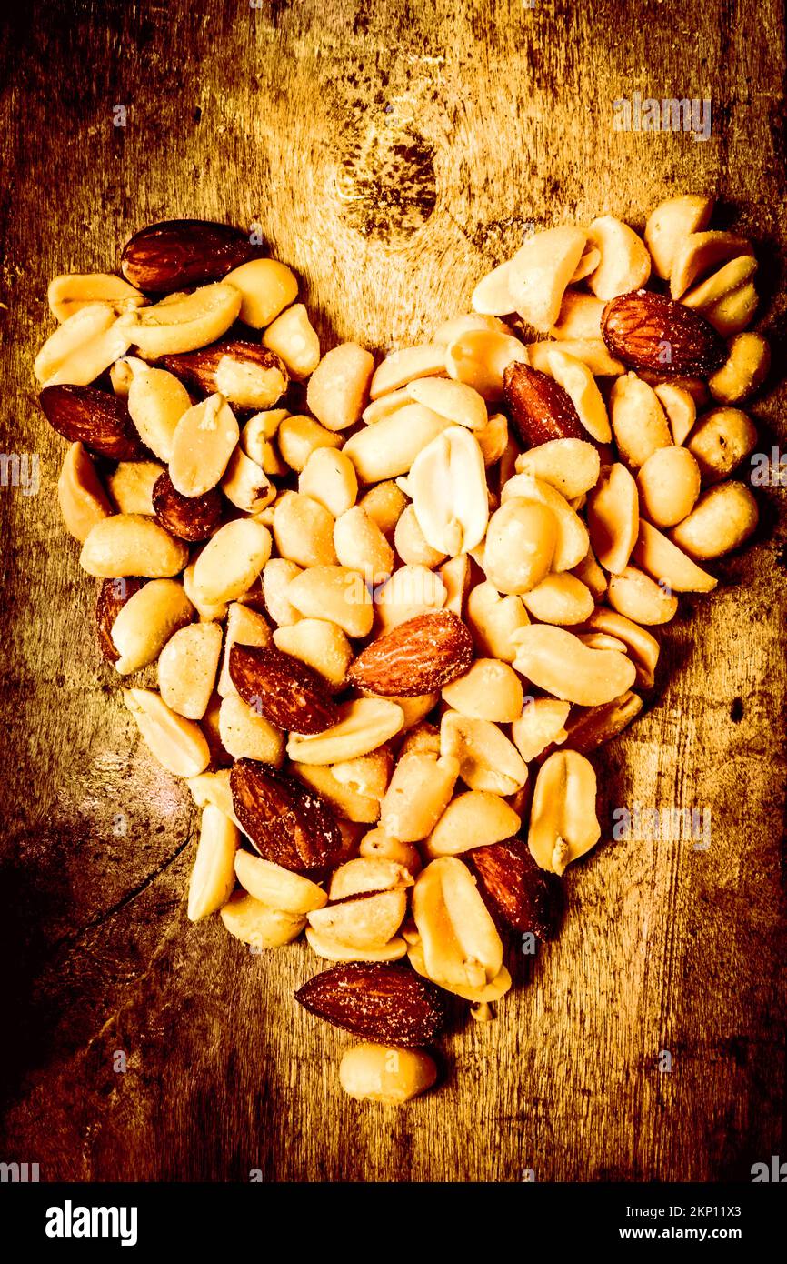 Still life farm art on heart healthy nuts grouped into the shape of ...