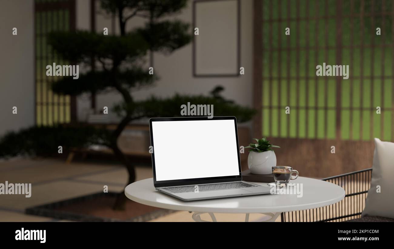 close-up image, Portable laptop white screen mockup is on a round table ...