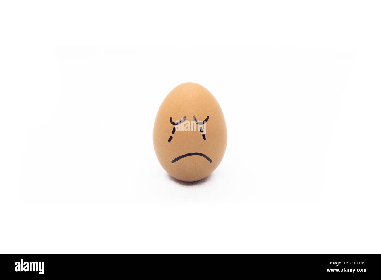 A crying egg on White background Stock Photo - Alamy