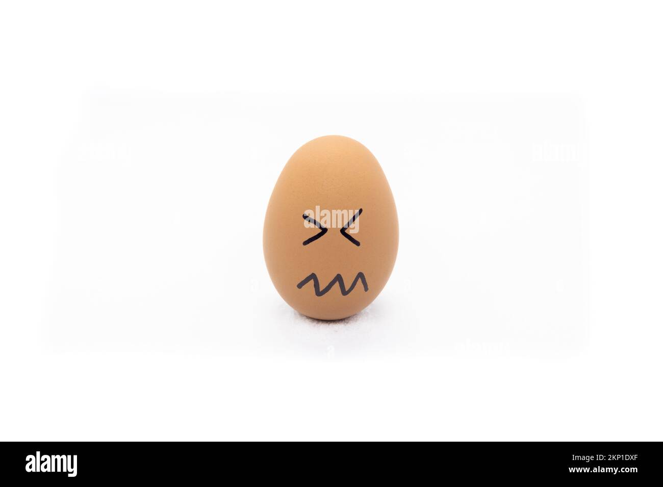 Worried egg on White background Stock Photo - Alamy