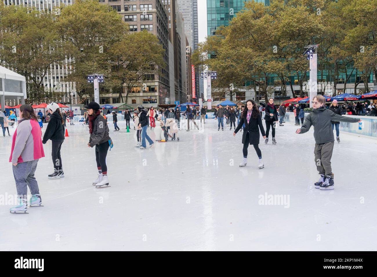 People visit winter village at Bryant Park to scate during holiday ...