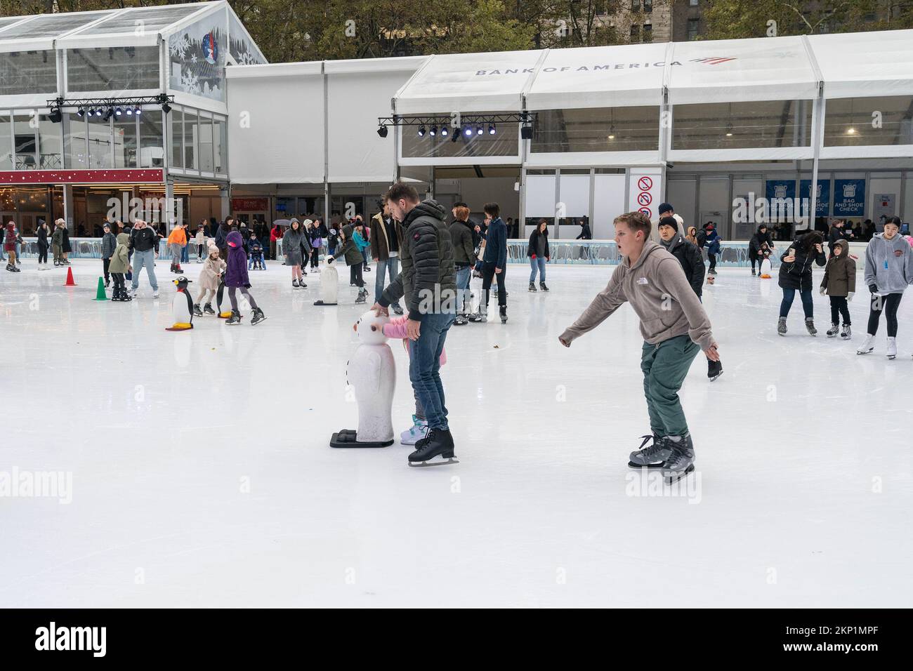 People visit winter village at Bryant Park to scate during holiday ...