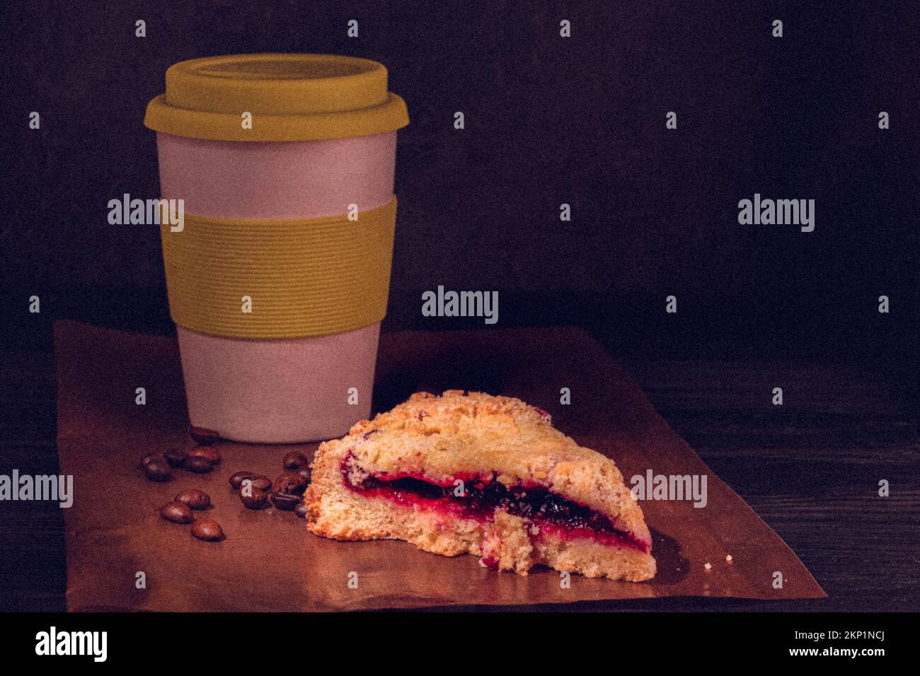 pie with a mug of coffee on a dark background. retro style with grain ...