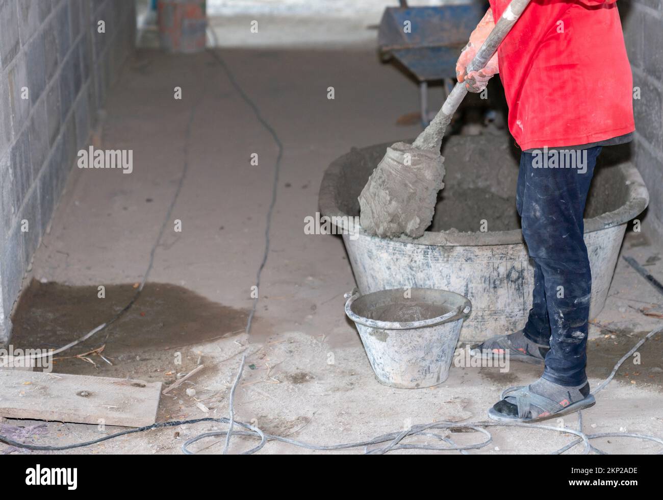 Mixing mortar with a construction mixer, apartment repair Stock Photo ...