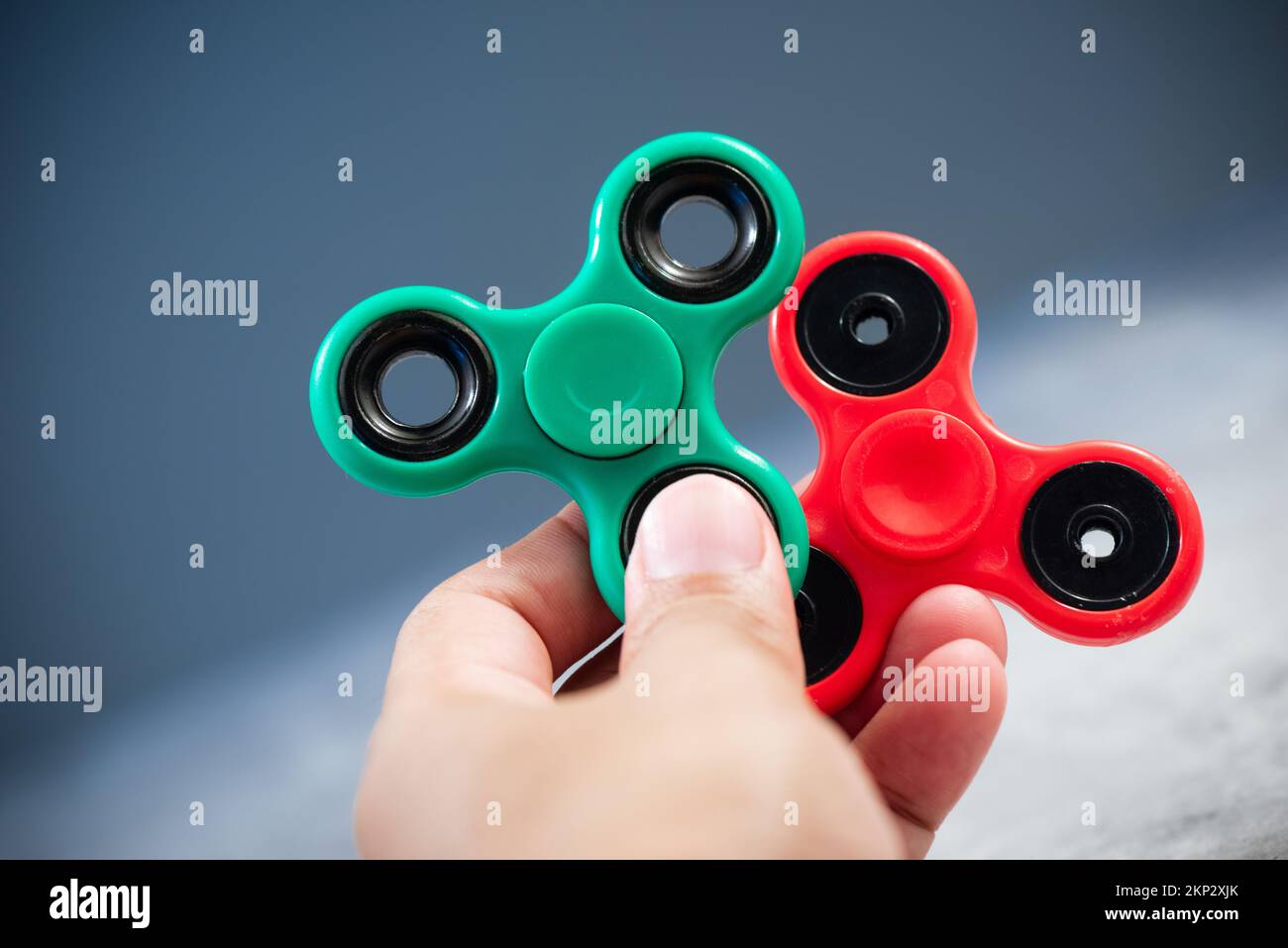 Plastic fidget spinner toy, stress and anxiety relieving toy Stock ...