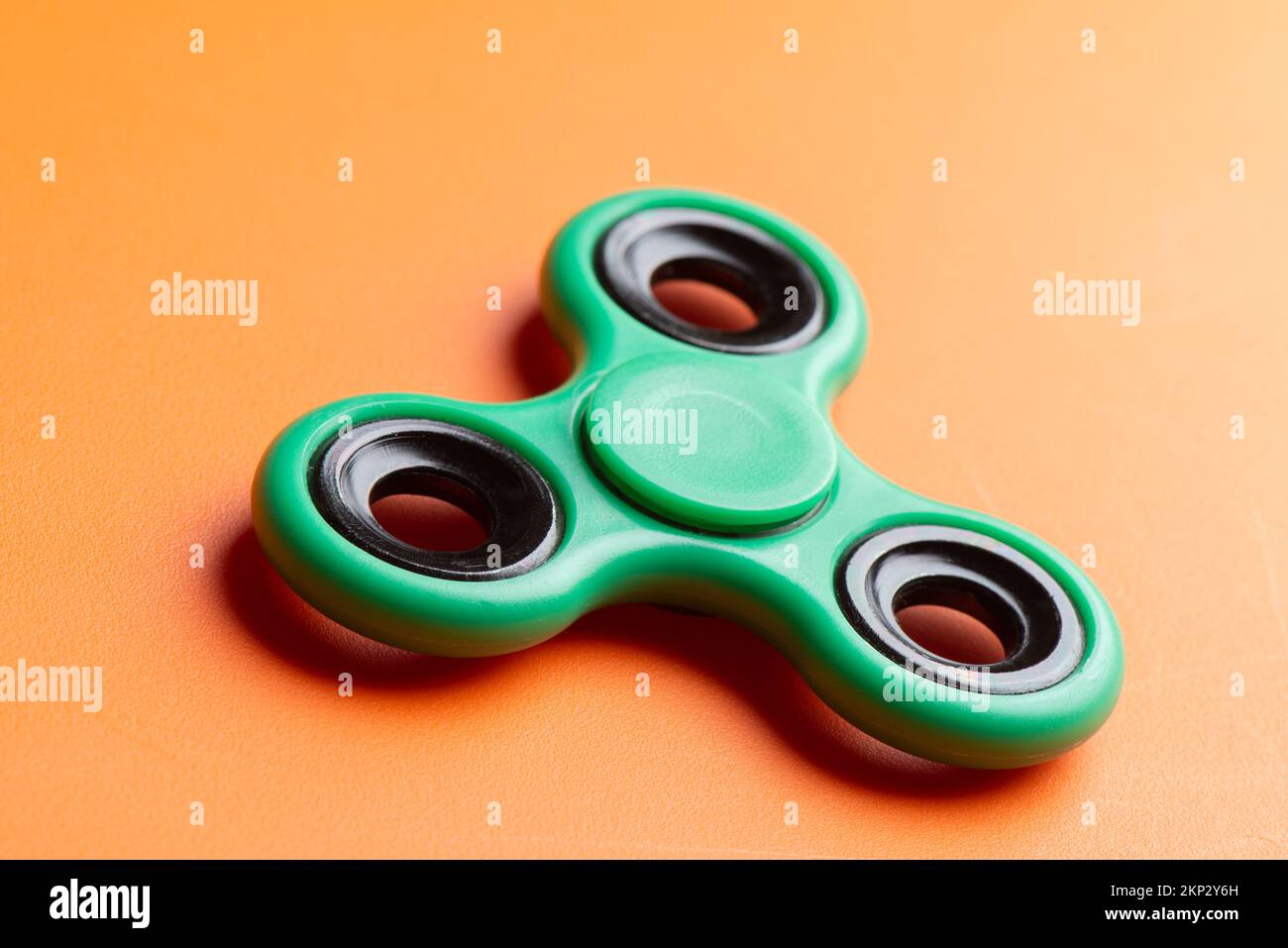 Plastic fidget spinner toy, stress and anxiety relieving toy Stock ...