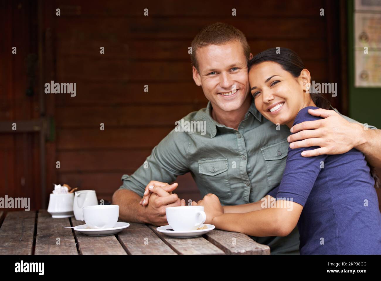 This girl knocks my socks off. Portrait of a young couple cuddling ...