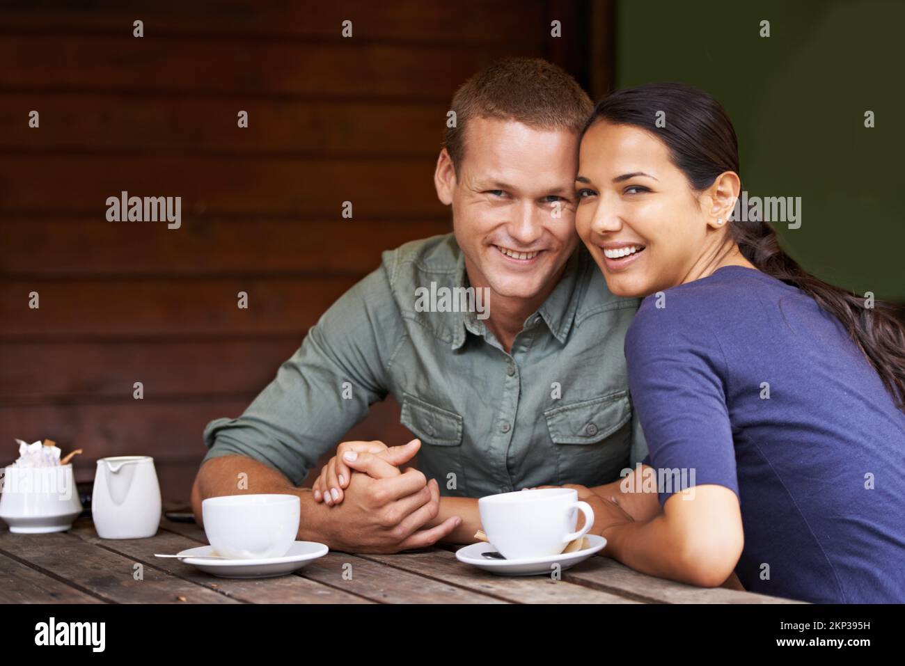 Bonding over a cuppa. a young multi-racial couple enjoying a cup of ...