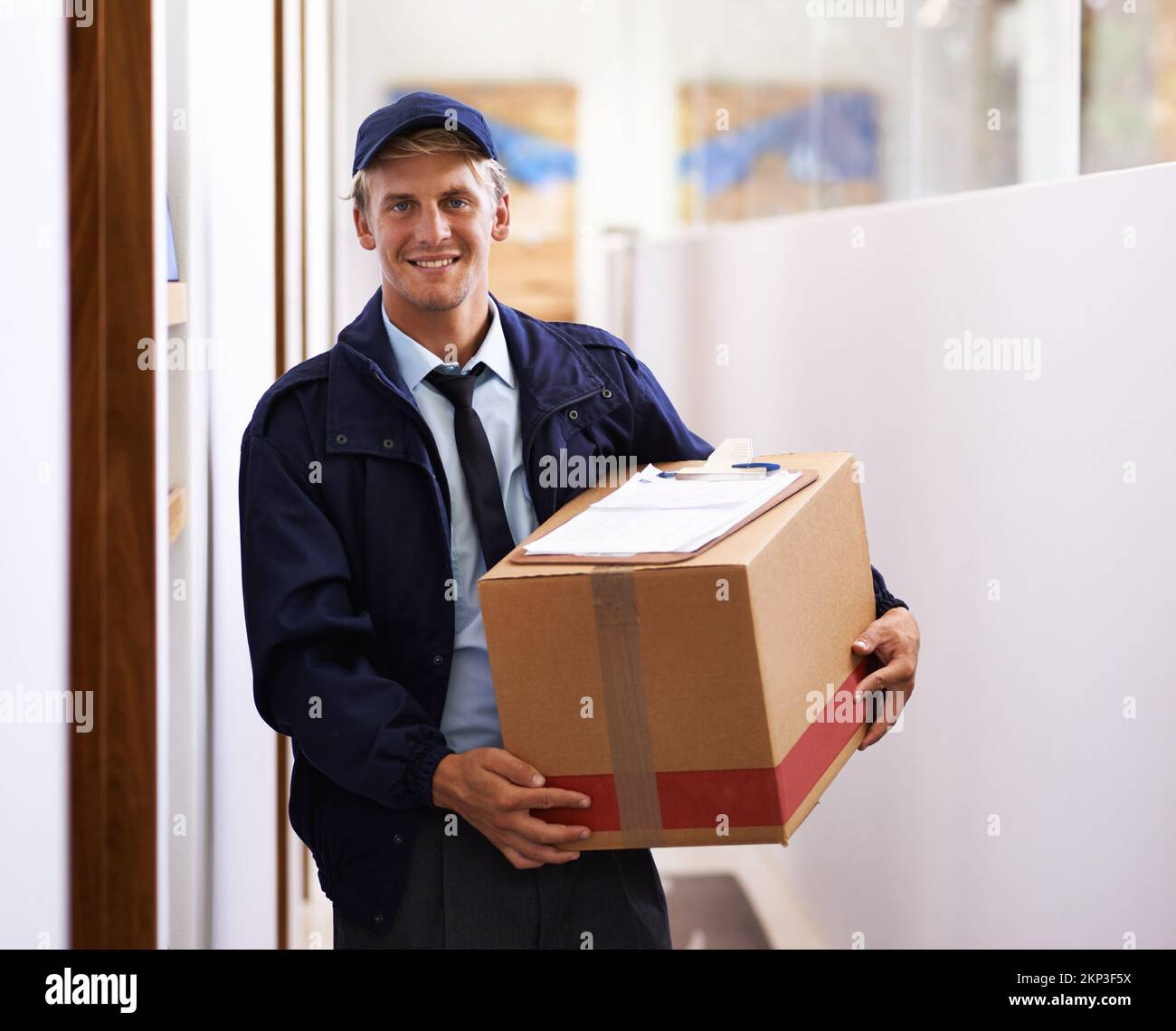 Your parcel is safe with us. a young man making a home delivery Stock ...