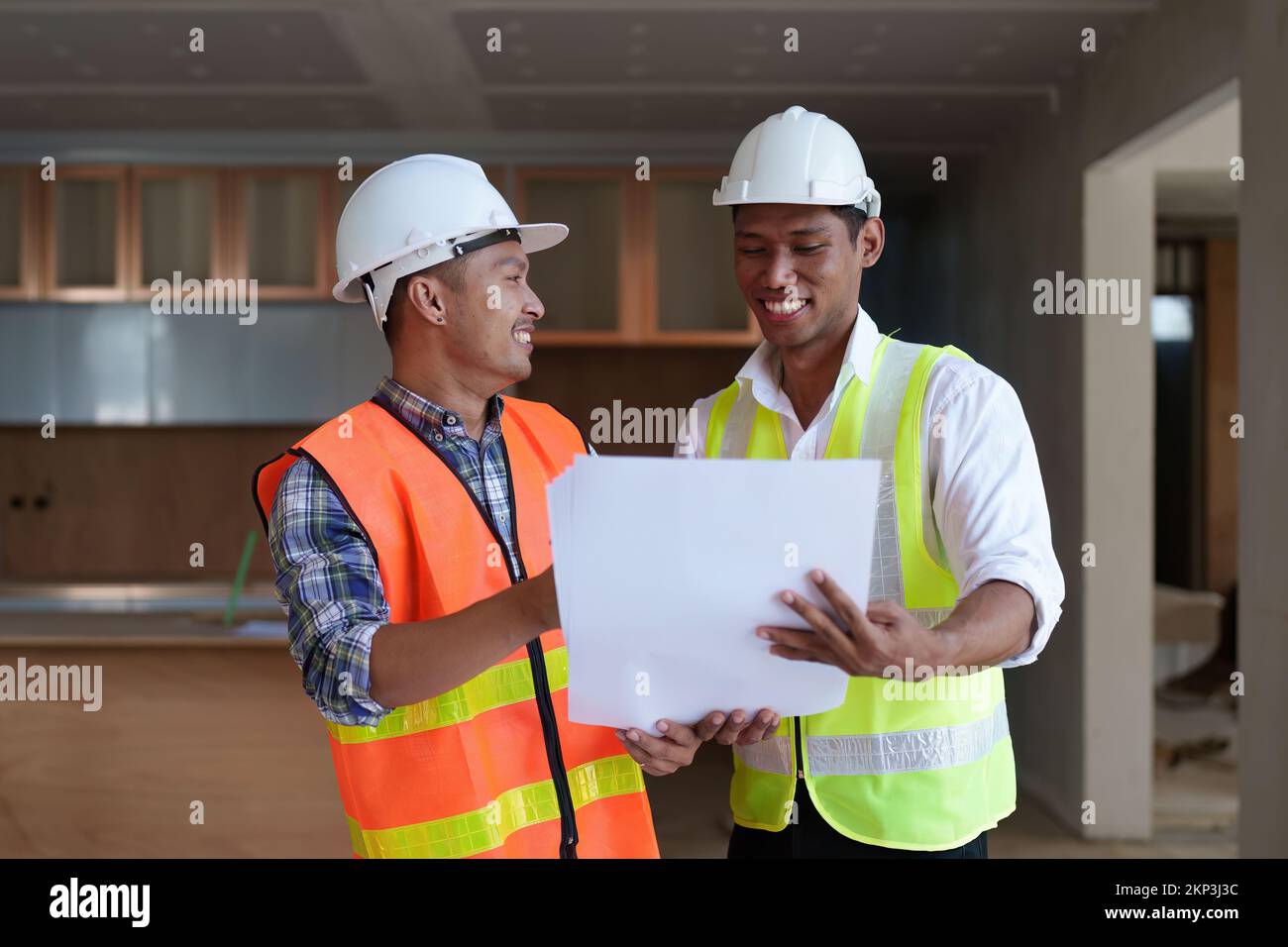 Professional architect designer structural engineer team colleagues discussing building plan ...