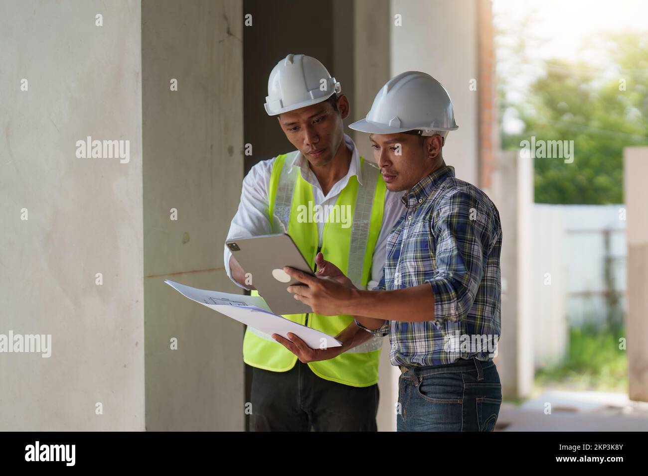 Professional architect designer structural engineer team colleagues discussing building plan ...