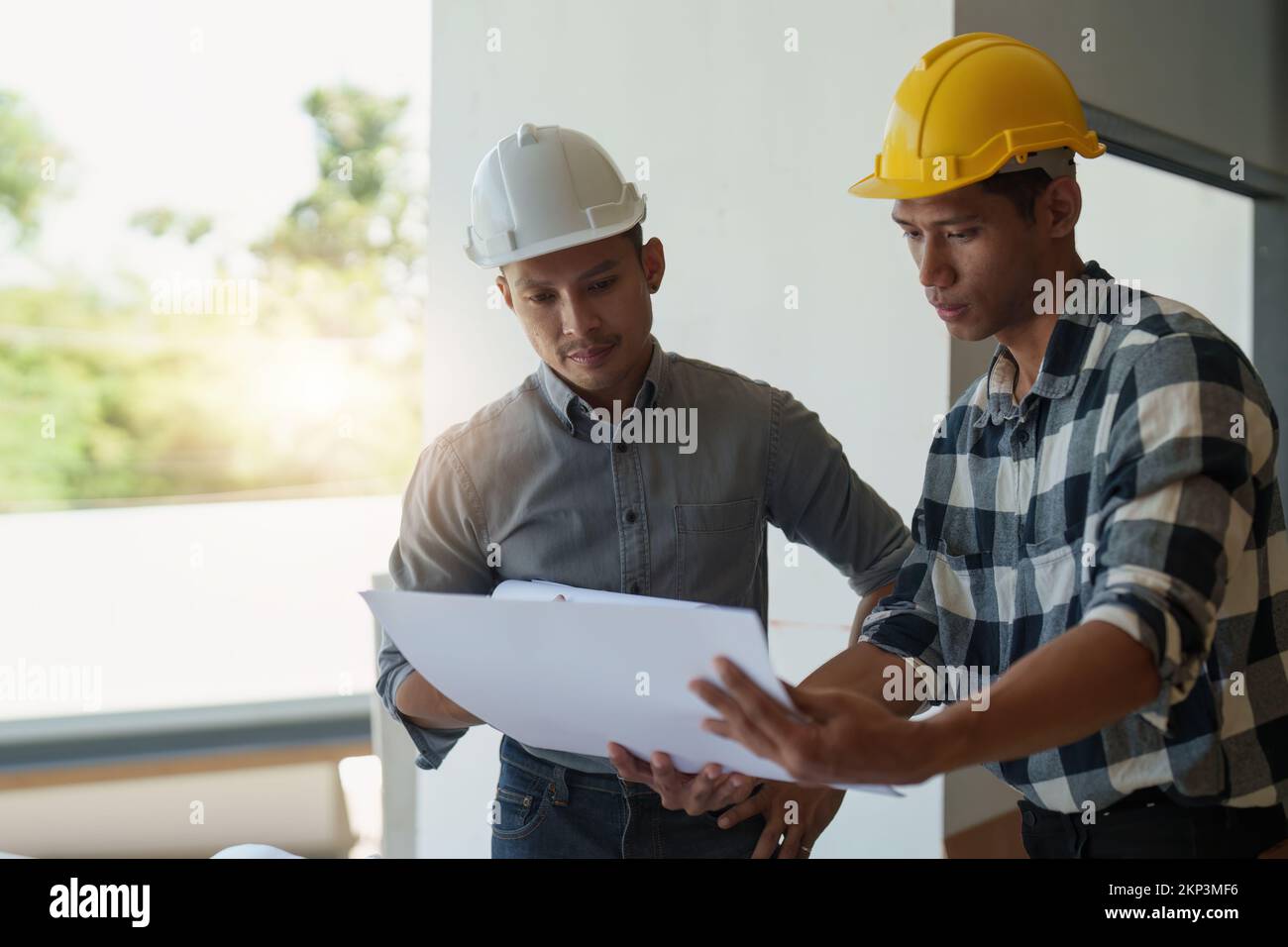 Professional architect designer structural engineer team colleagues discussing building plan ...