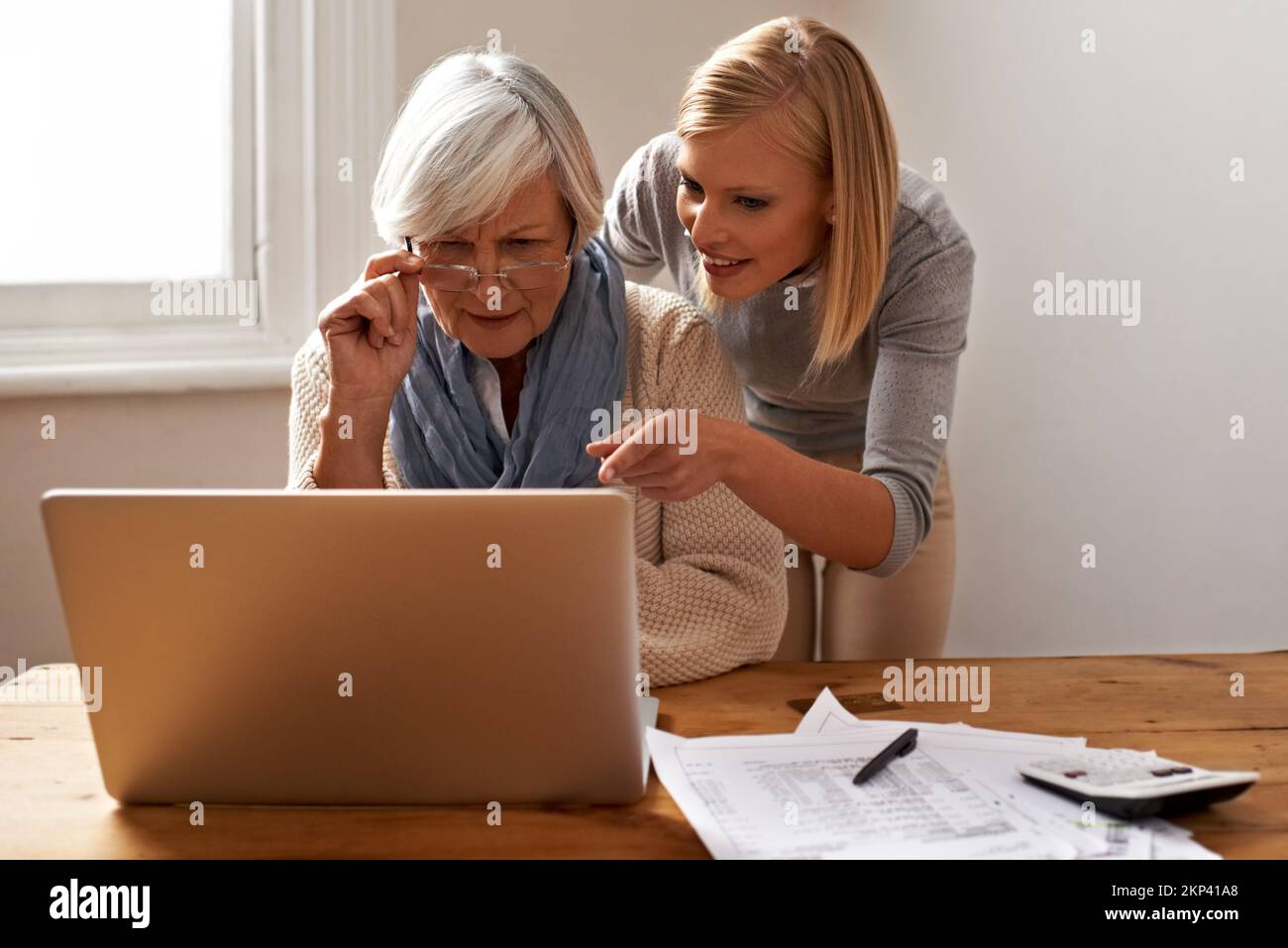 Getting some help from her granddaughter to speed things along. Cropped ...