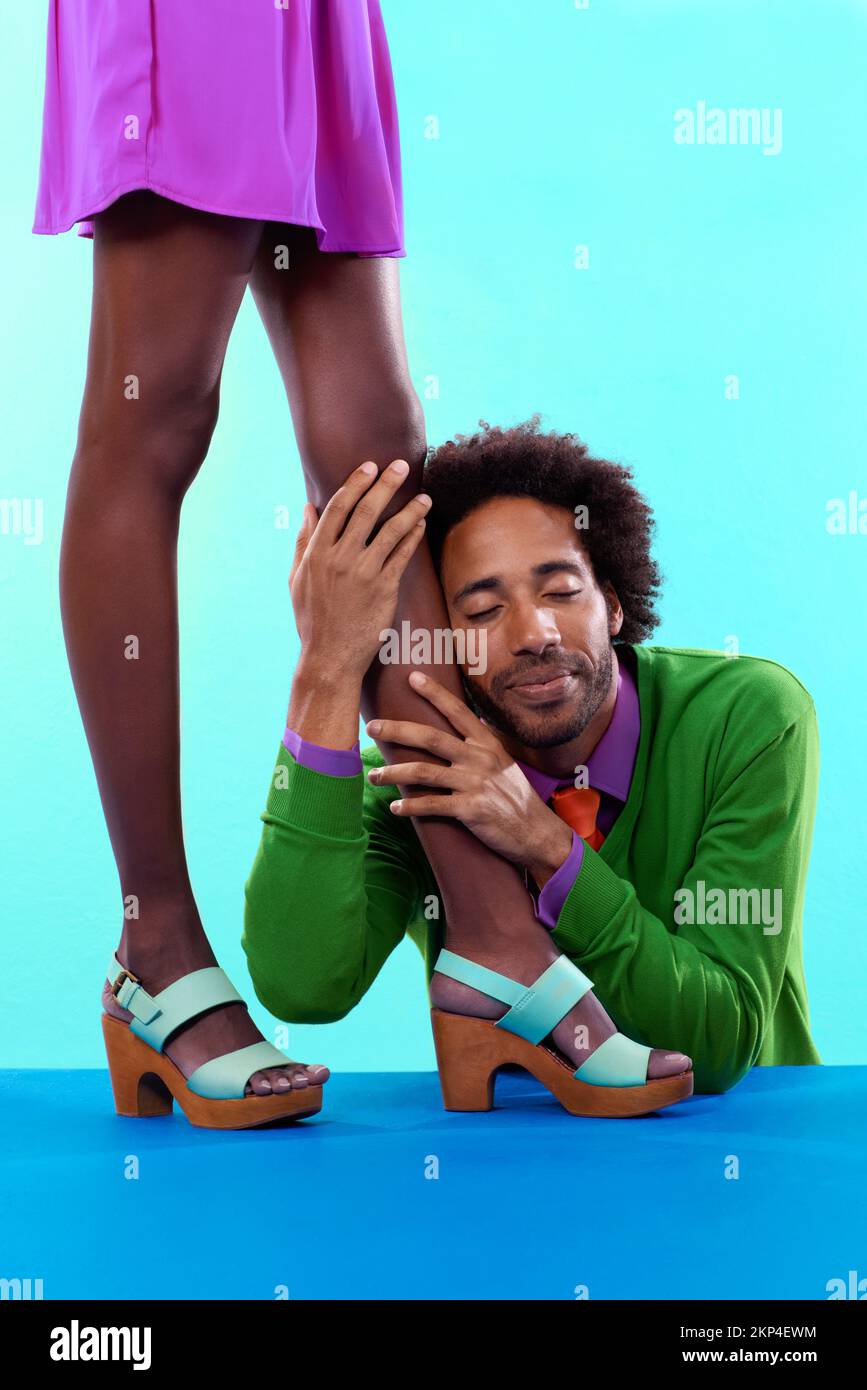 Who loves you baby. Studio shot of a young man holding his girlfriends ...