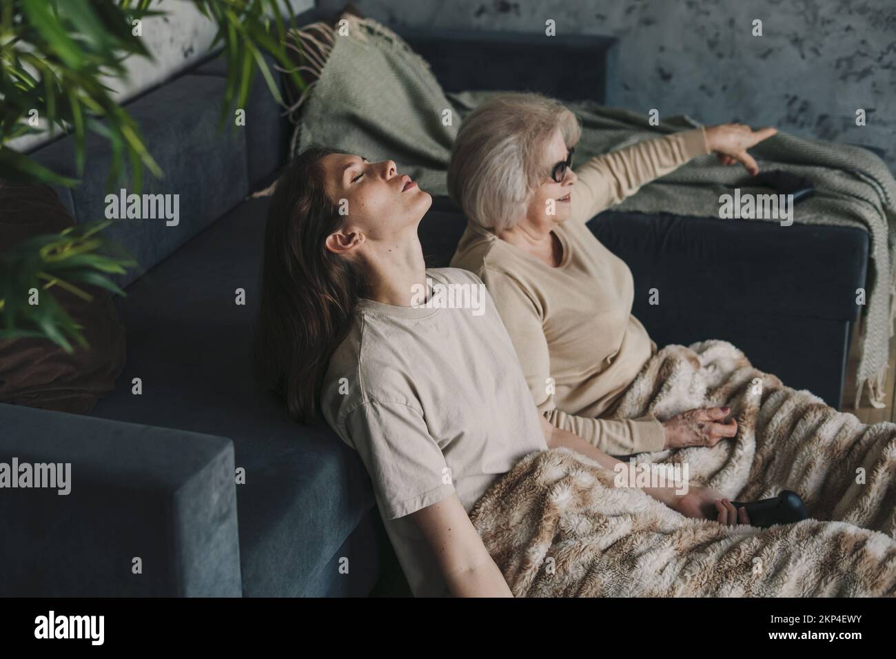 Old woman playing playstation having fun like crazy together with her ...