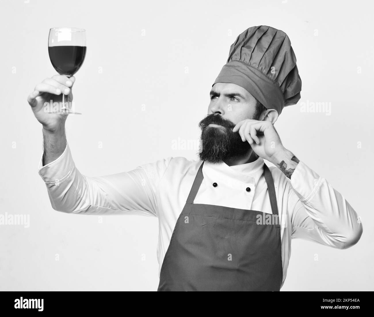 Man holds glass red Black and White Stock Photos & Images - Alamy