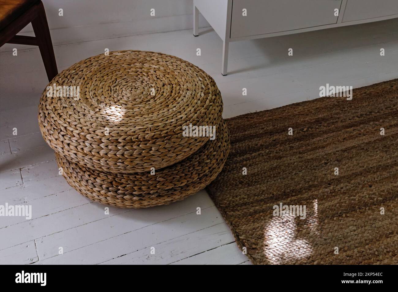 Minimalist modern interior details, rattan rug Stock Photo - Alamy